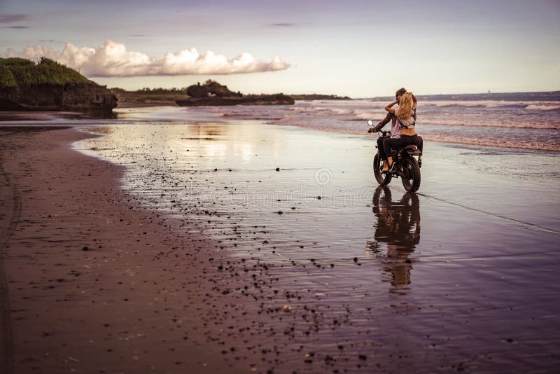 Back View of Couple Riding Motorcycle on Sandy Ocean Beach Stock Image ...