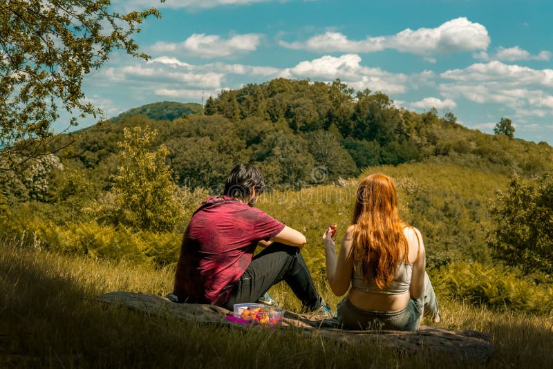 Back View of a Couple Sitting in the Mountains Stock Image - Image of ...
