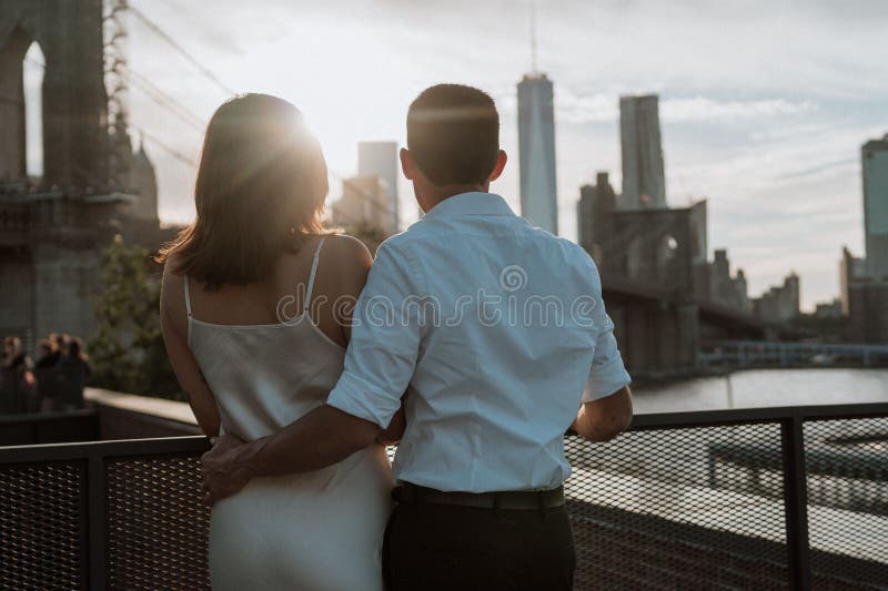 Back View of a Couple Standing and Looking at the New York Skyscrapers ...
