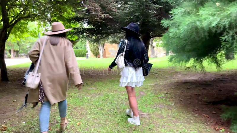 Back View of Couple of Two Young Girls Walking in the Park Stock ...