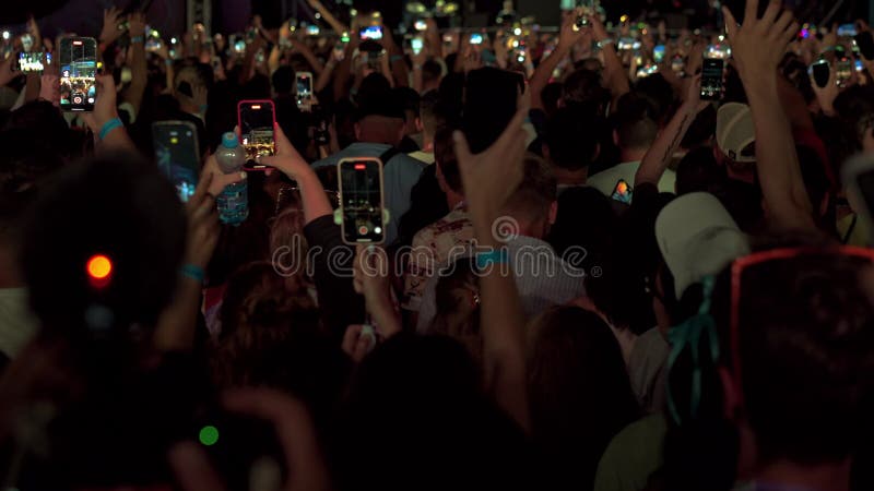 Back View of a Crowd of People at an Outdoor Concert Stock Footage ...