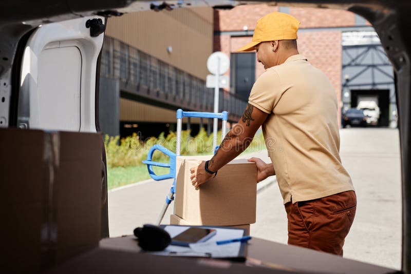Delivery Worker Unloading Boxes Stock Image - Image of person ...