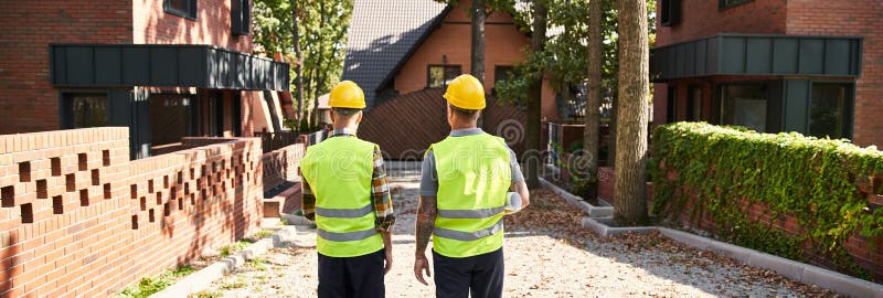 Back View of Devoted Construction Workers Stock Photo - Image of ...