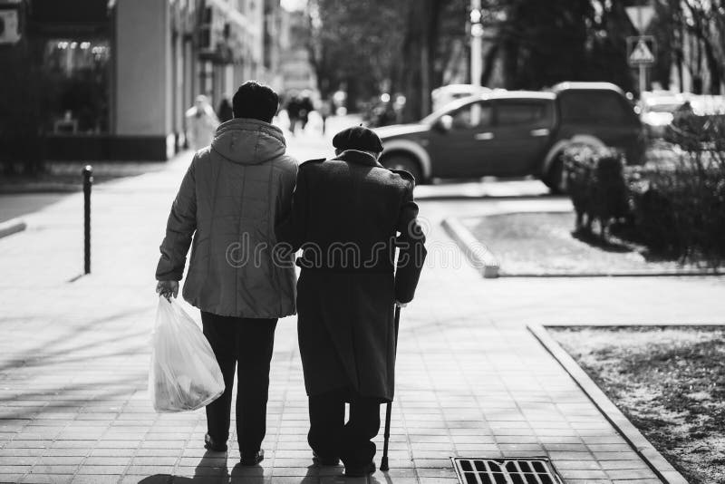 Back View of Elder Couple Walking in the Street. Editorial Stock Image ...