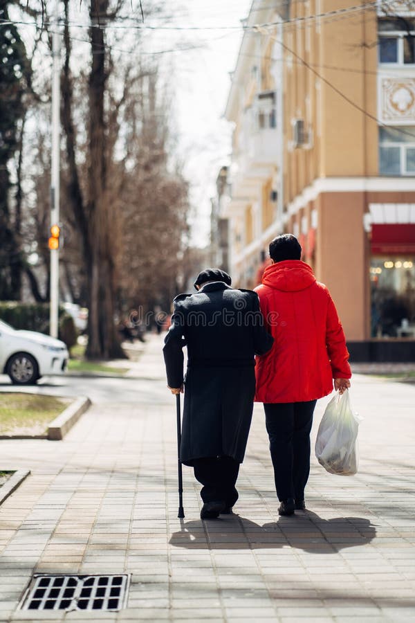 Back View of Elder Couple Walking in the Street. Editorial Stock Photo ...
