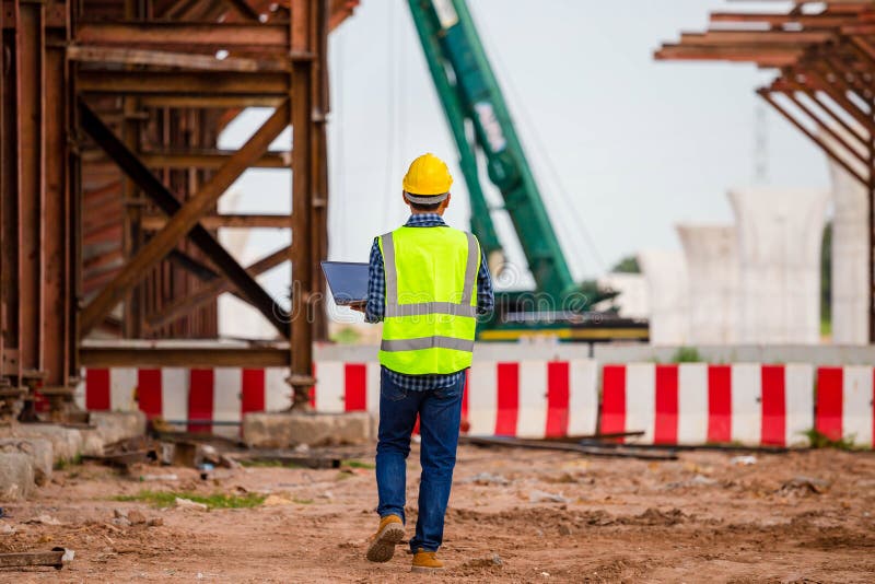 Back View of Engineer Checking Project at the Building Site, Man in ...