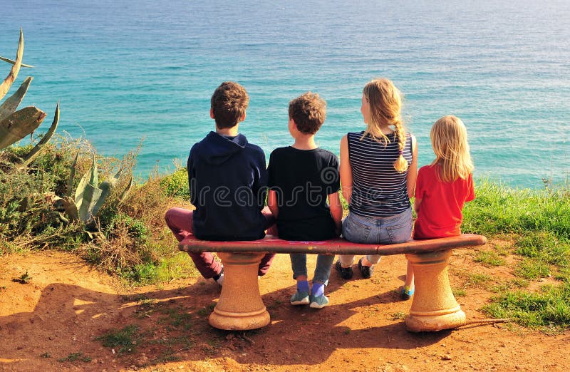 Back View of Family of Four Sitting on Beach Stock Image - Image of ...