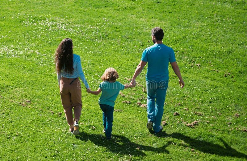 Back View of Family Spending Time Together Outside in Green Nature ...