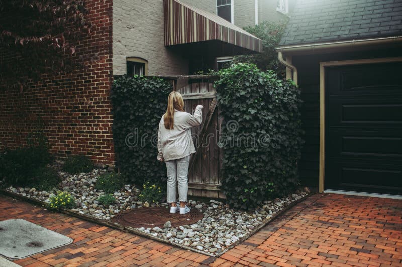 Back View of a Female in Front of the Brick Wall Building Stock Image ...