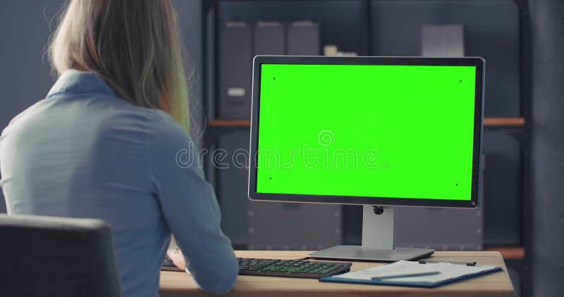 Female Office Worker Looking at Green Computer Screen Stock Footage ...