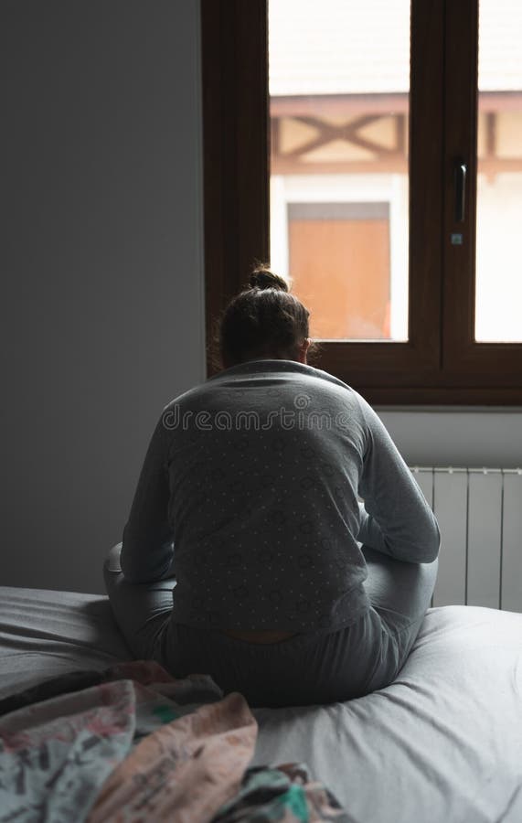 Back View of a Female Sitting on Her Bed Stock Photo - Image of morning ...
