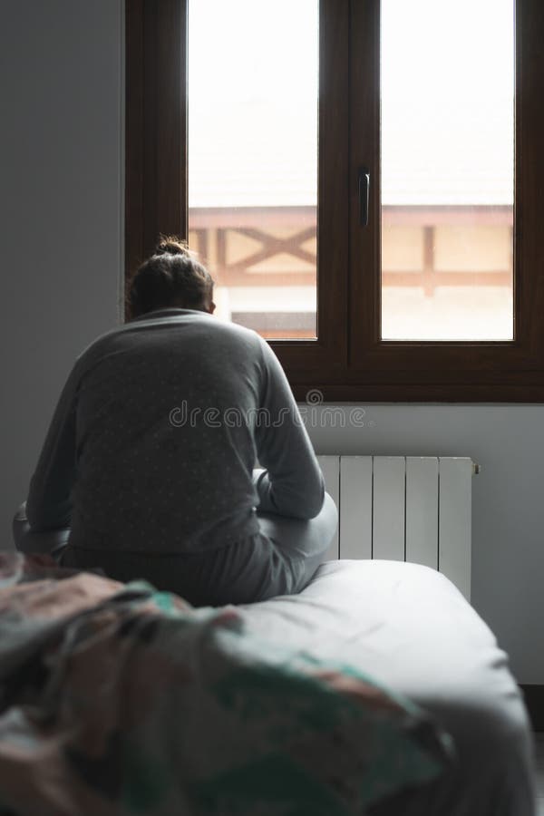 Back View of a Female Sitting on Her Bed Stock Image - Image of home ...