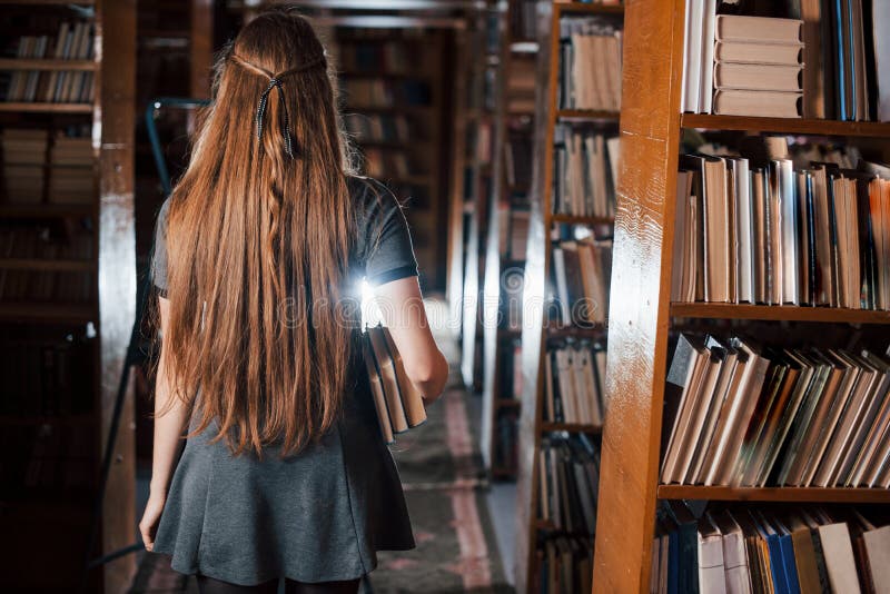 Back View. Female Student is in Library that Full of Books Stock Image ...