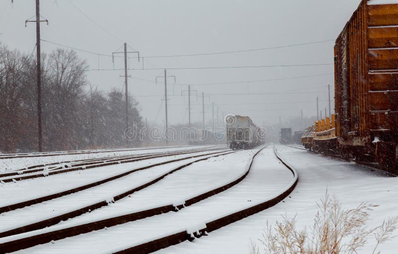 Back View of Freight Train Running on the Railway Tracks in Winter ...