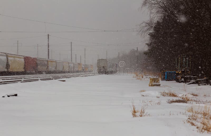 Back View of Freight Train Running on the Railway Tracks in Winter ...