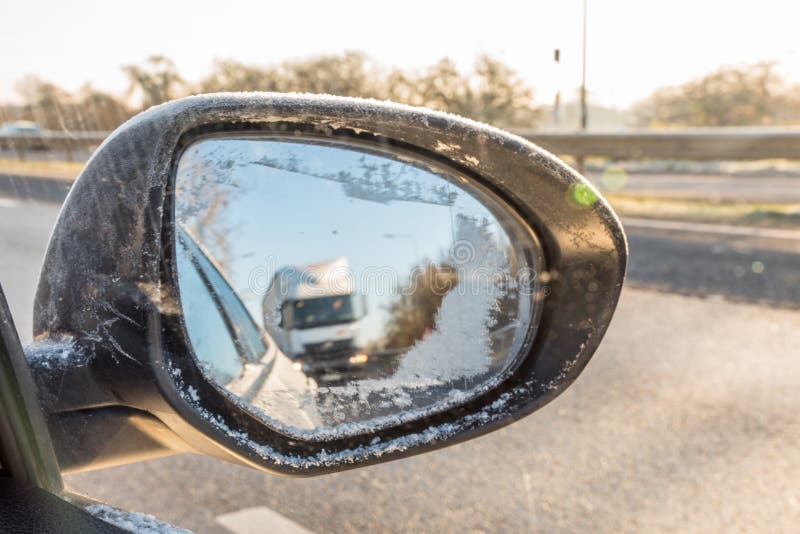 Back View through Frozen Car Wing Mirror on Motorway Stock Image ...