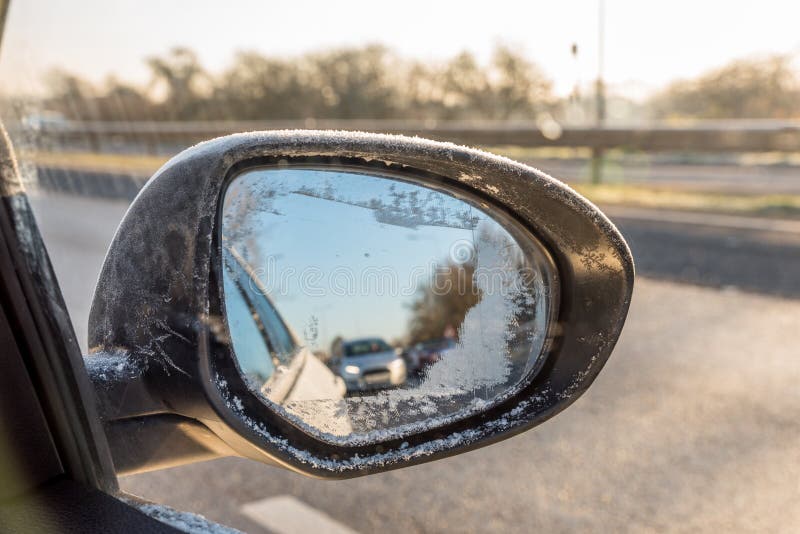 Back View through Frozen Car Wing Mirror on Motorway Stock Photo ...