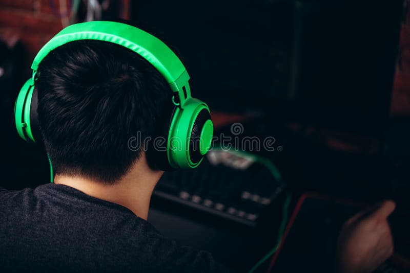Back View of Gamer in Headphones Playing Video Game Stock Photo - Image ...