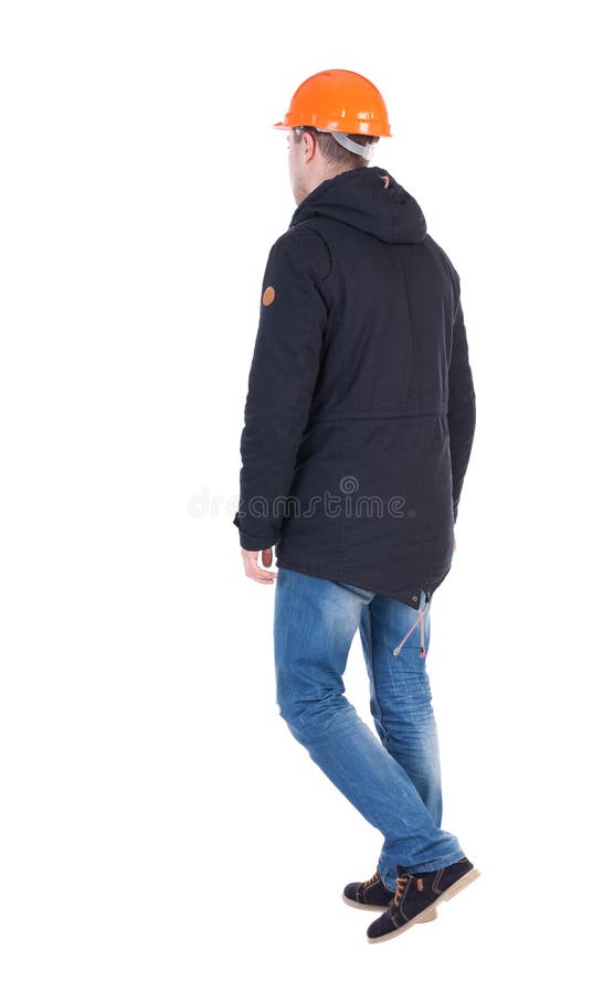 Back View of GoingWorker in a Helmet. Walking Young Engineer Stock ...