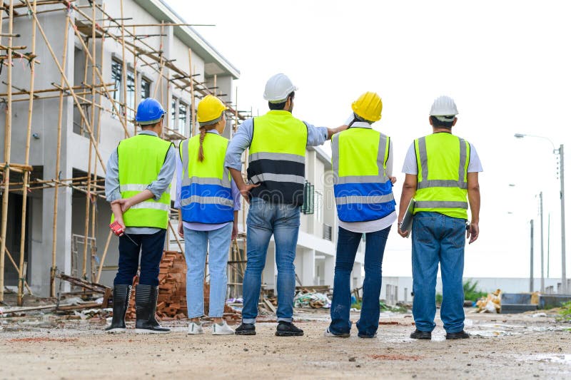 Back View of Group of Happy Contractors, Engineers and Formats in ...