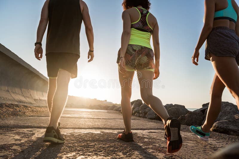 Back View of a Group of Young Runners Exercising Outdoors Stock Photo ...