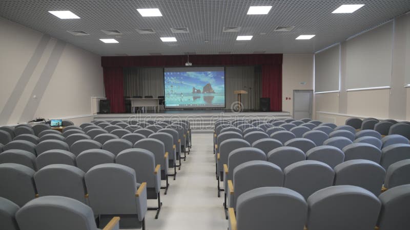 Back View of Hall with Projection Screen and Fabric Seating Stock Video ...