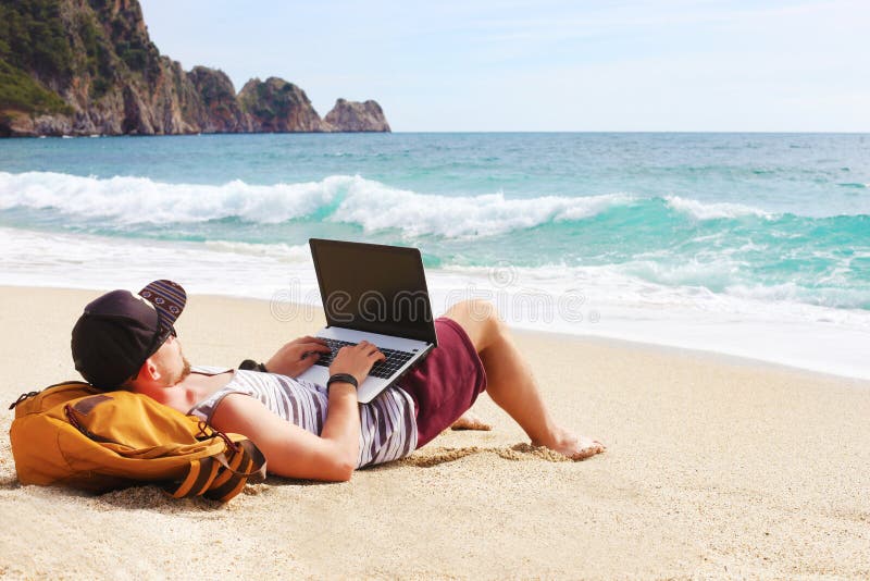 Beach laptop vacation stock image. Image of handsome - 24982105