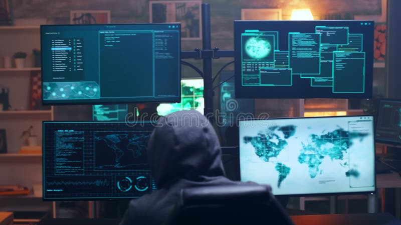 Back View of Hooded Cyber Terrorist Using Super Computer Stock Image ...
