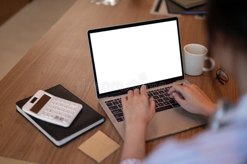 Back View Image of a Businesswoman Using Her Laptop, Typing on the ...