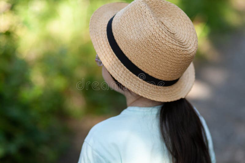 Back View of a Little Girl Wearing a Straw Hat in the Park Stock Image ...