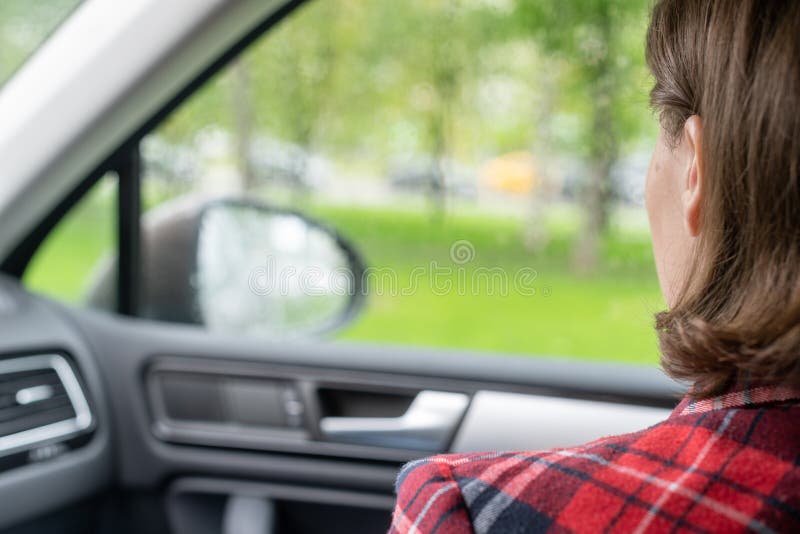 Back View of Lonely Girl Looking through Rainy Window with Drop of Car ...