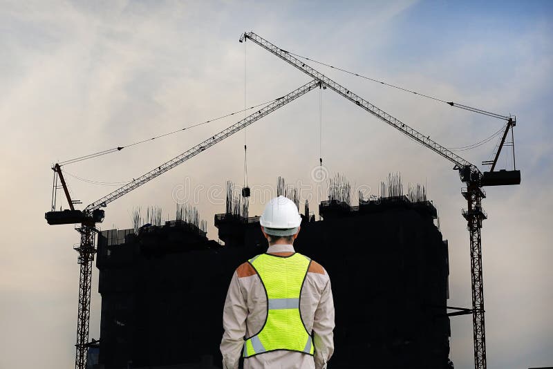 Back View of Male Construction Worker Against Construction Site at ...