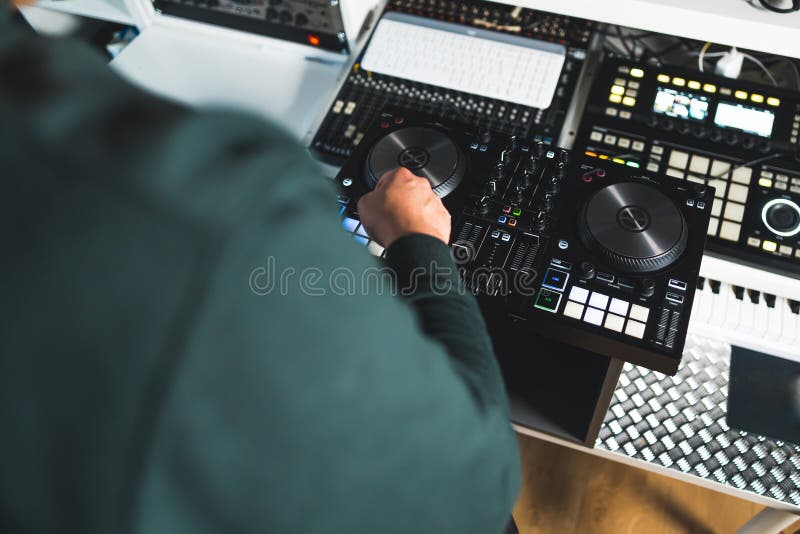 Back View of a Male DJ Working on Sound Mixing Board in Home Recording ... Back View of a Male DJ Working on Sound Mixing Board in Home Recording ...