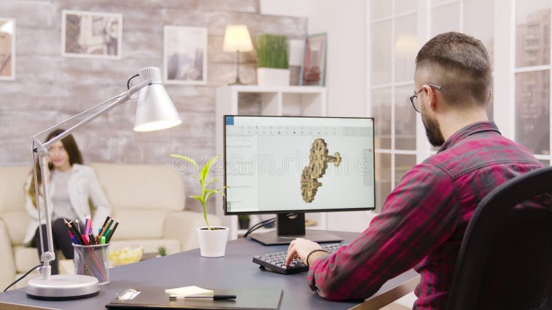 Back View of Male Engineer Working on a Mechanical Concept Stock ...