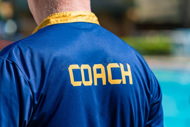 Back View Of Male Swimming Coach Wearing Coach Shirt Stock Image