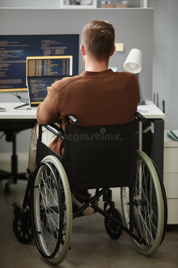 Back View Man with Disability Writing Code Working at Desk in Office ...
