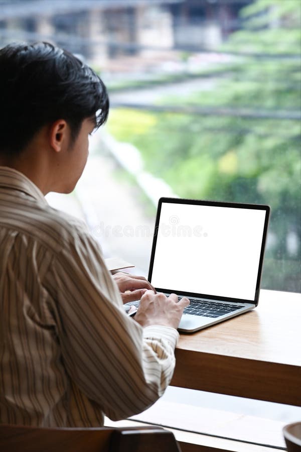 Man Freelancer Sitting in Coffee Shop and Working with Laptop Computer ...
