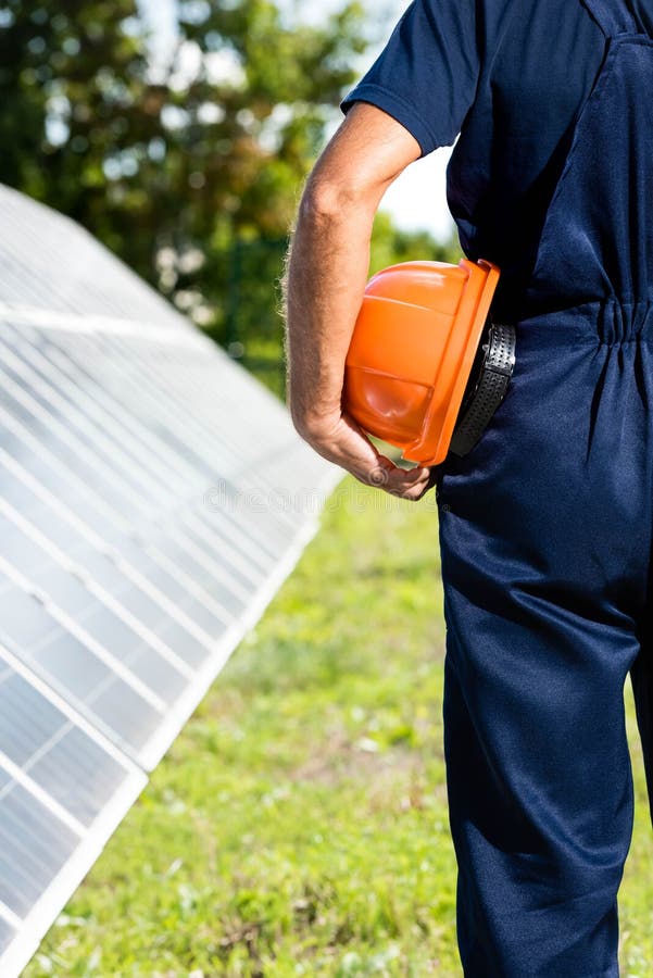 Back View of Man in Overalls with Orange Hardhat. Stock Photo - Image ...