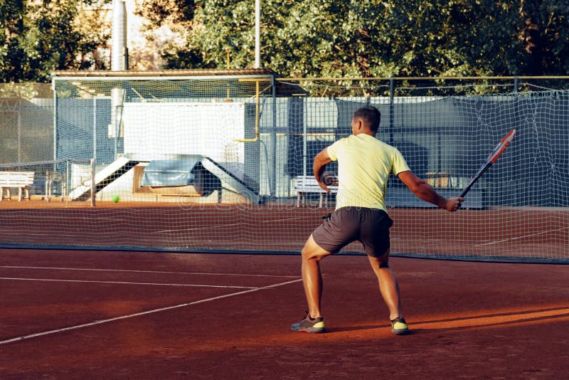 Back View of a Man Playing Tennis on Tennis Court Stock Image - Image ...
