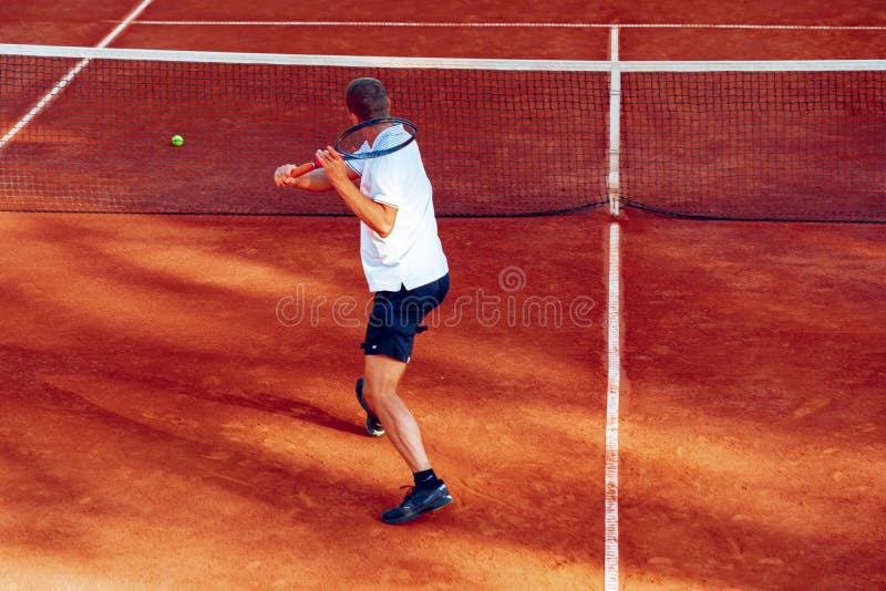Back View of a Man Playing Tennis on Tennis Court Stock Photo - Image ...