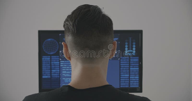Back View of Man Programmer Working on Computer at Office Stock Footage ...