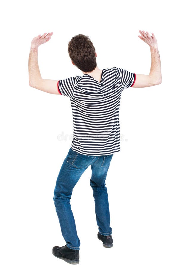 Back View. Man Protects Hands from What is Falling from Above Stock ...