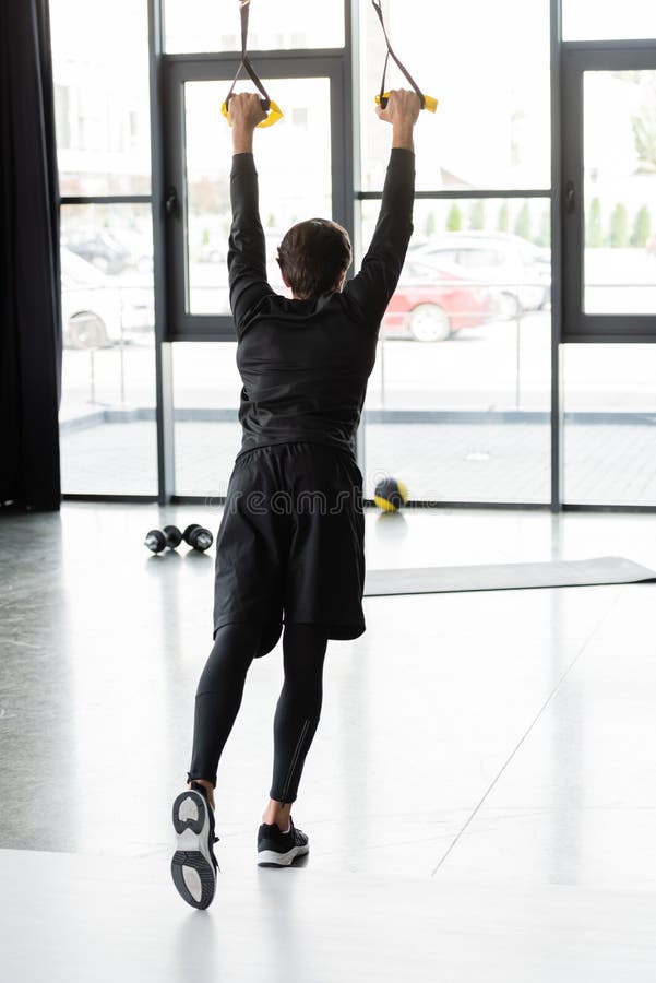 Back View of Man Pulling Suspension Stock Image - Image of workout ...