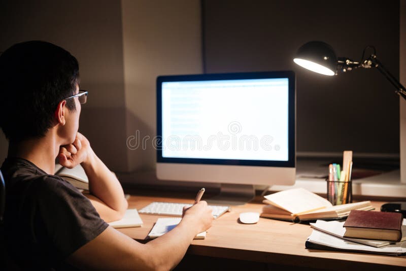 Back View of Man Reading Information from Blank Screen Computer Stock ...