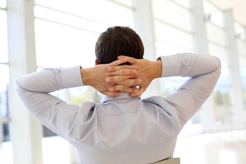 Back View of Man Relaxing at Work Stock Image - Image of relaxation ...
