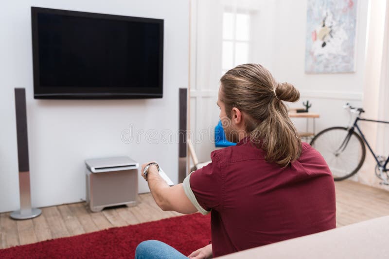 Back View of Man with Remote Watching Tv Stock Image - Image of ...