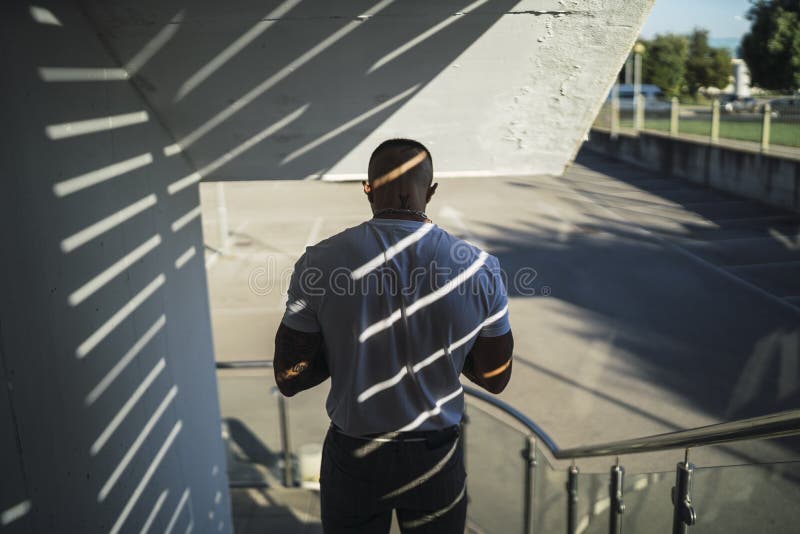 Back View of a Man with Shadows Falling on His Back Stock Image - Image ...