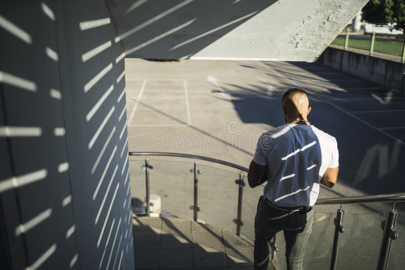 Back View of a Man with Shadows Falling on His Back Stock Photo - Image ...