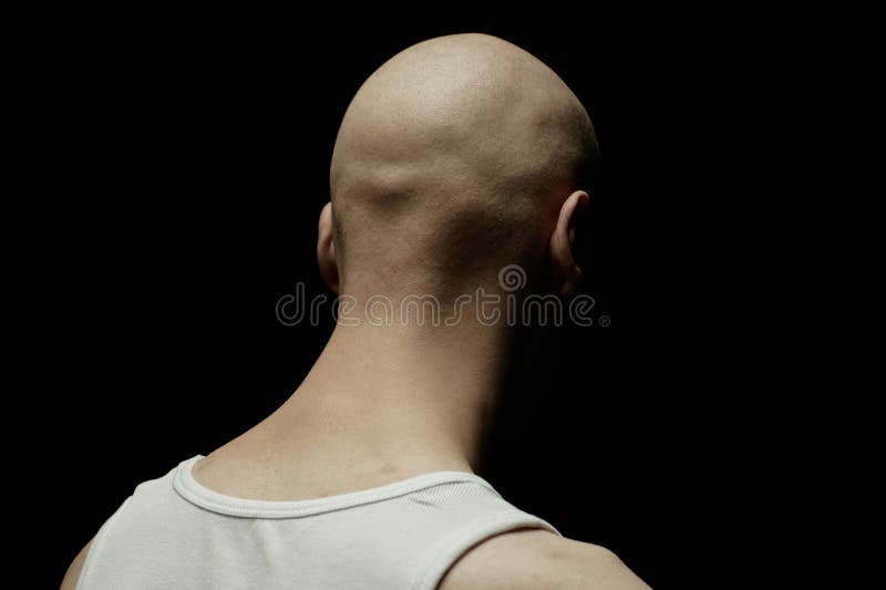 Back View of Man with Shaved Head Hiding Face in Shadow in Dark Studio ...