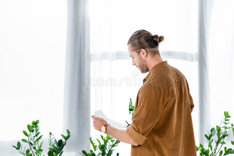 View of Man in Shirt Doing Paperwork in Office Stock Photo - Image of ...